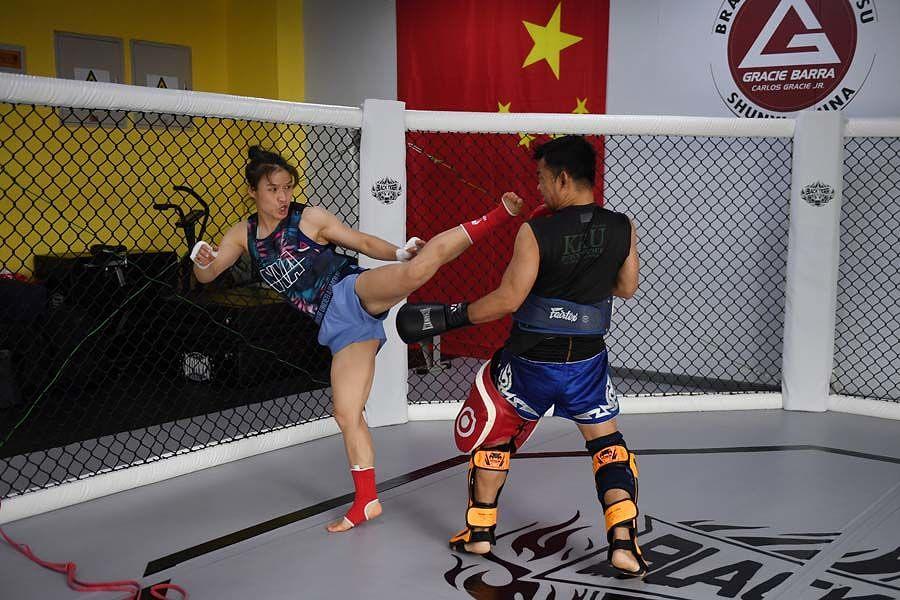 Inspired by Ronda Rousey, China's Zhang aims at MMA history | BALIPOST.com